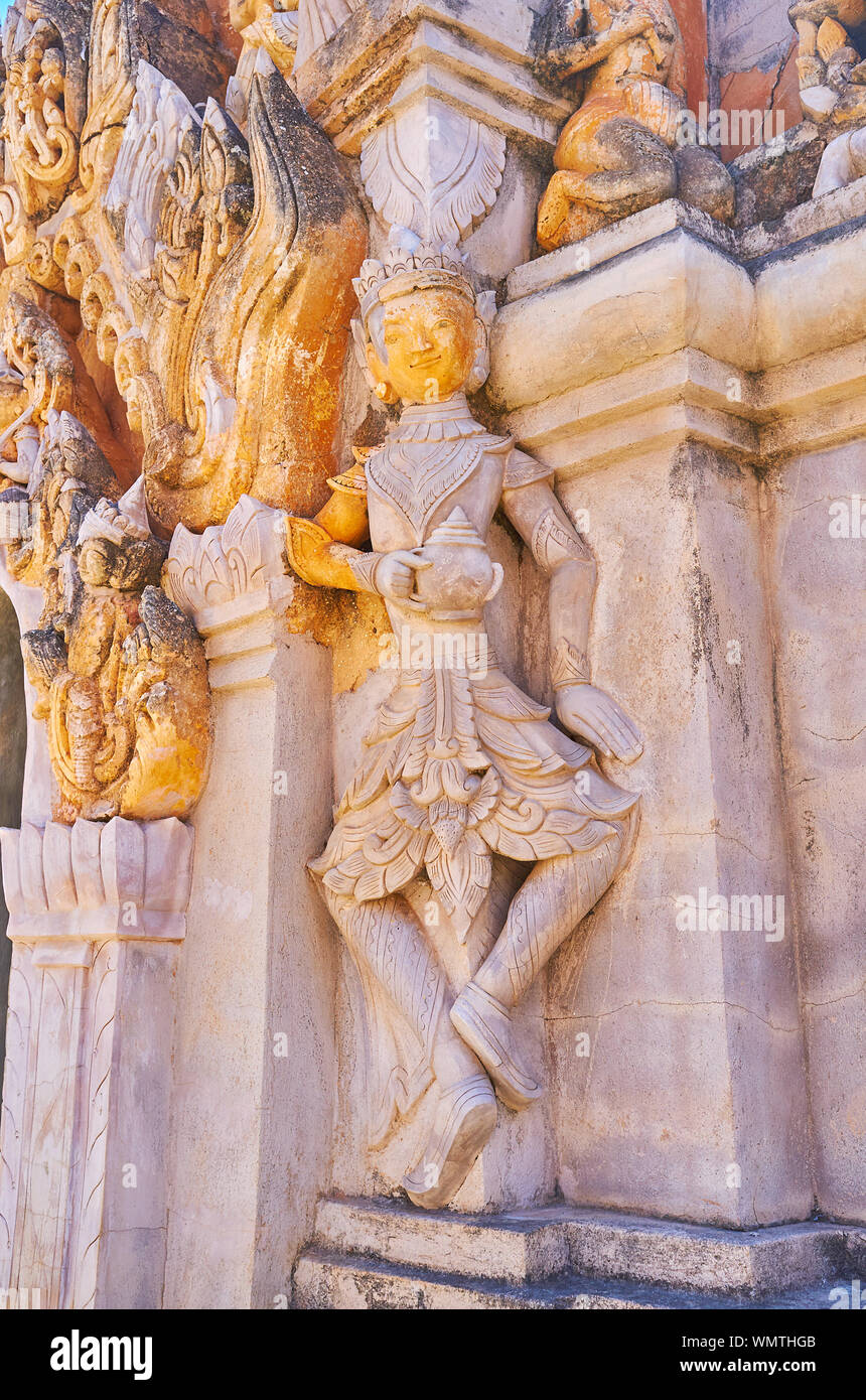 The cornar stucco sculpture of dancing Nat (spirit deity), decorating ...