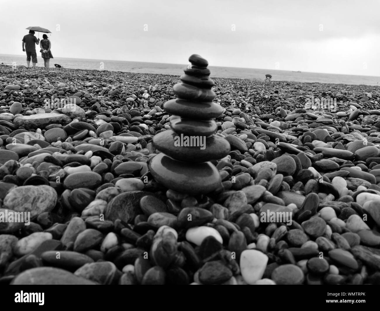 Stacked pebbles by water Black and White Stock Photos & Images - Alamy