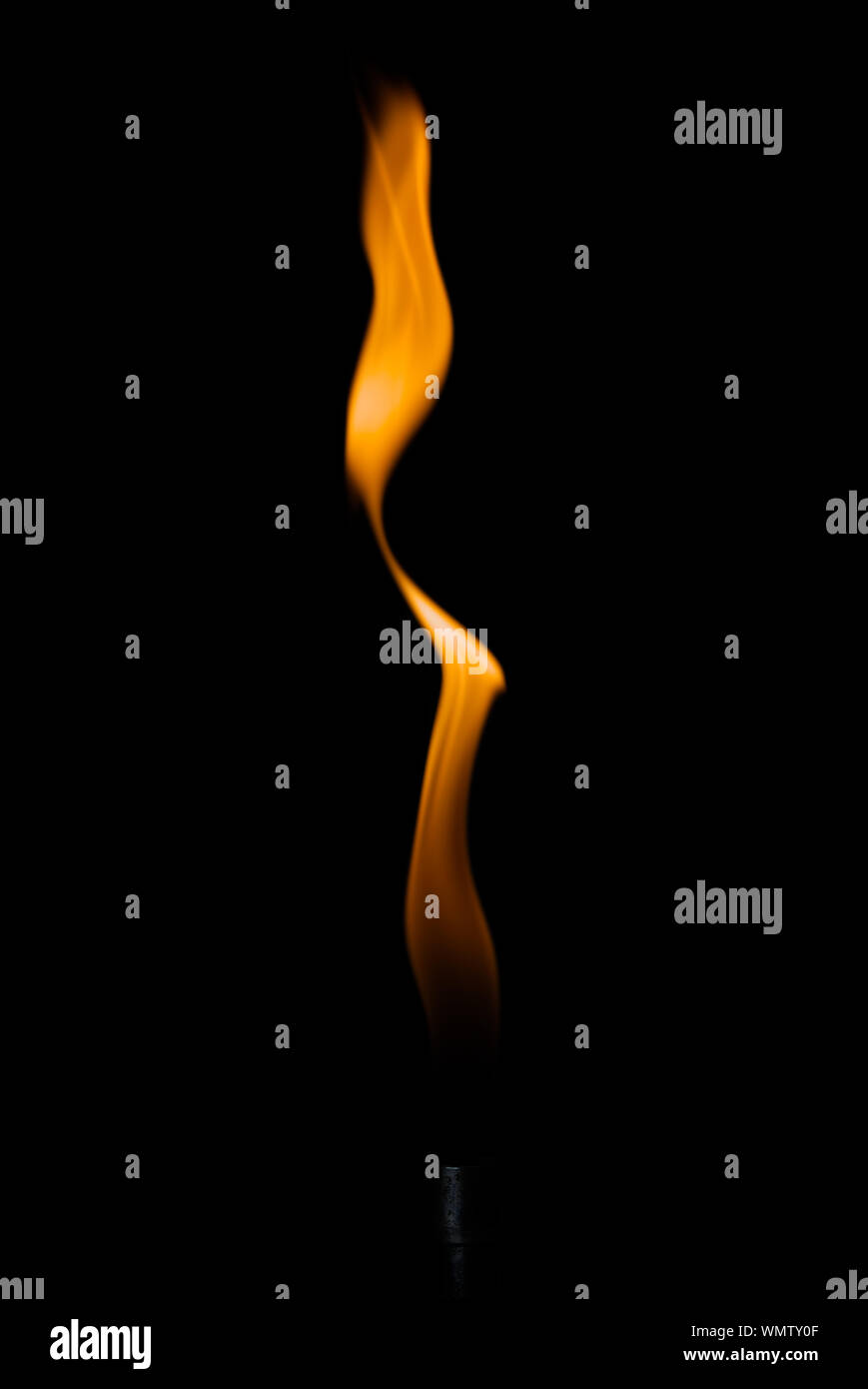 Burner flame isolated on a black background in a school science lab ...