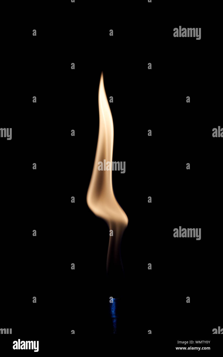 Burner flame isolated on a black background in a school science lab ...