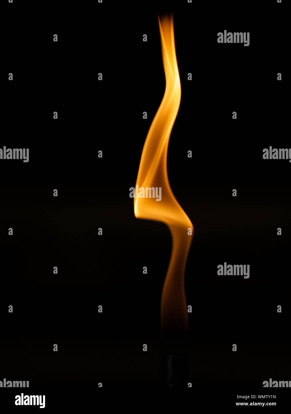 Burner flame isolated on a black background in a school science lab ...