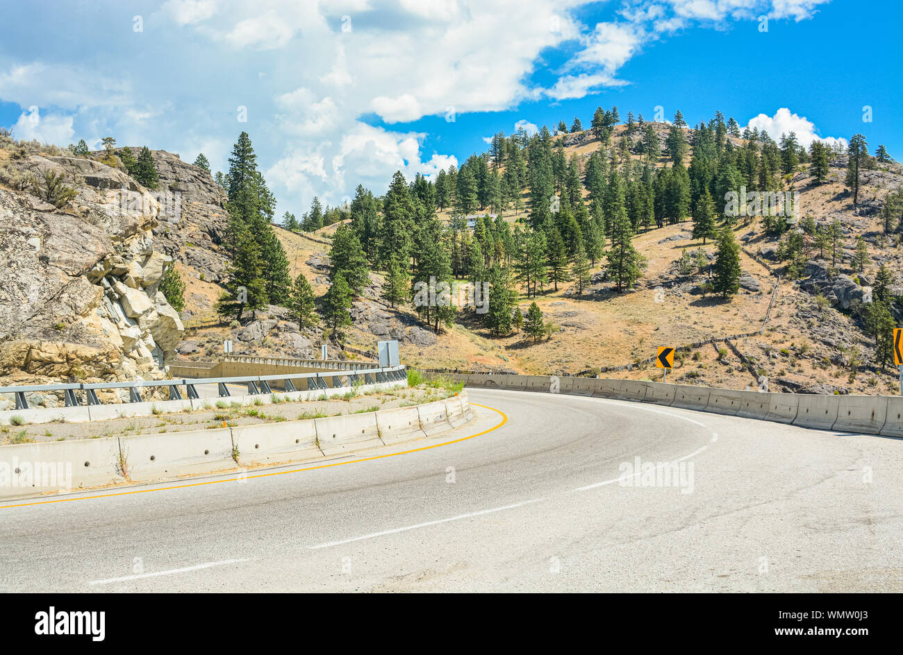 Yellow bend in the road sign hi-res stock photography and images - Alamy