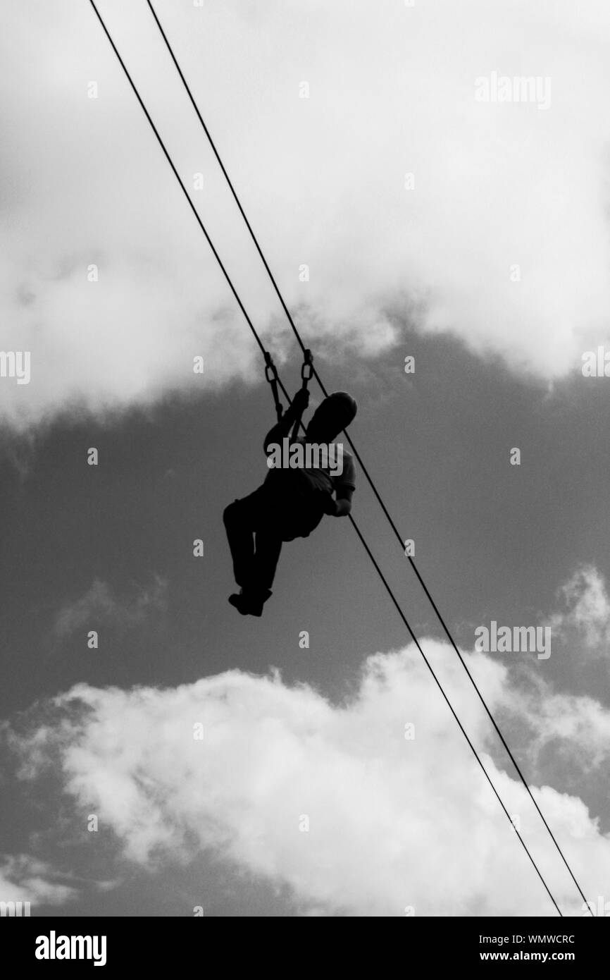 Person zip lining hi-res stock photography and images - Alamy