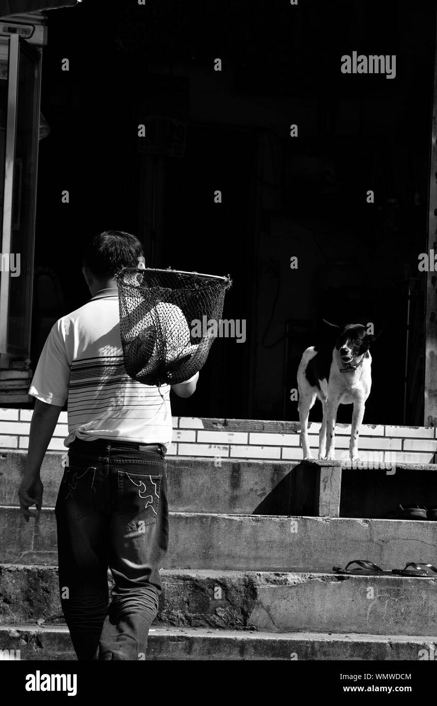 Carrying fishing net Black and White Stock Photos & Images - Alamy