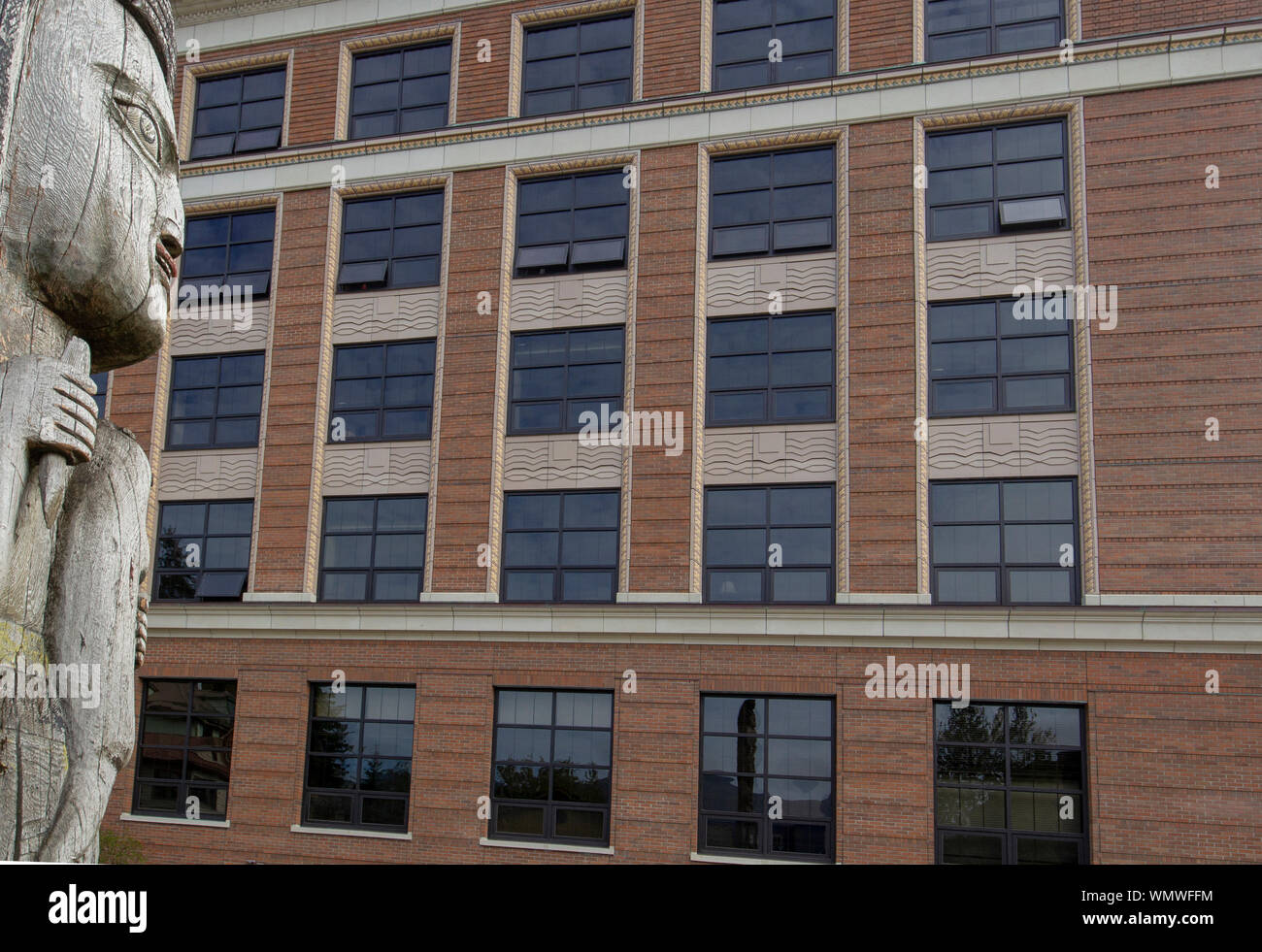 Alaska State Capital building in Juneau Alaska with a totem pole of the ...