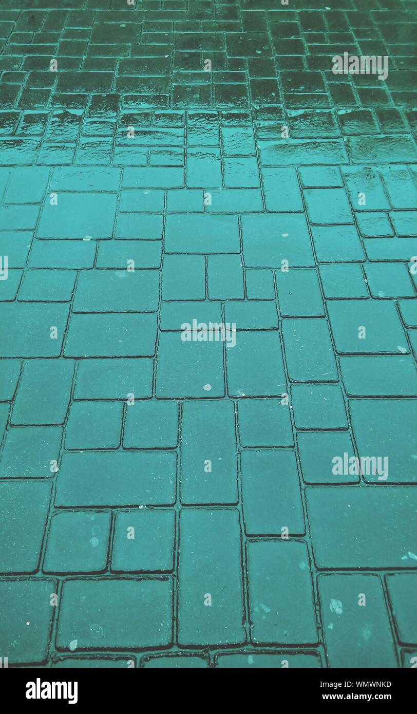Rainy cobbled street hi-res stock photography and images - Alamy