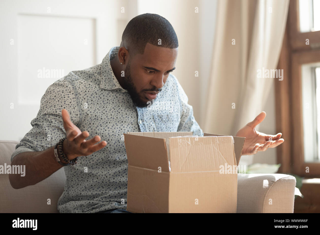 Confused client received wrong or damaged item Stock Photo - Alamy