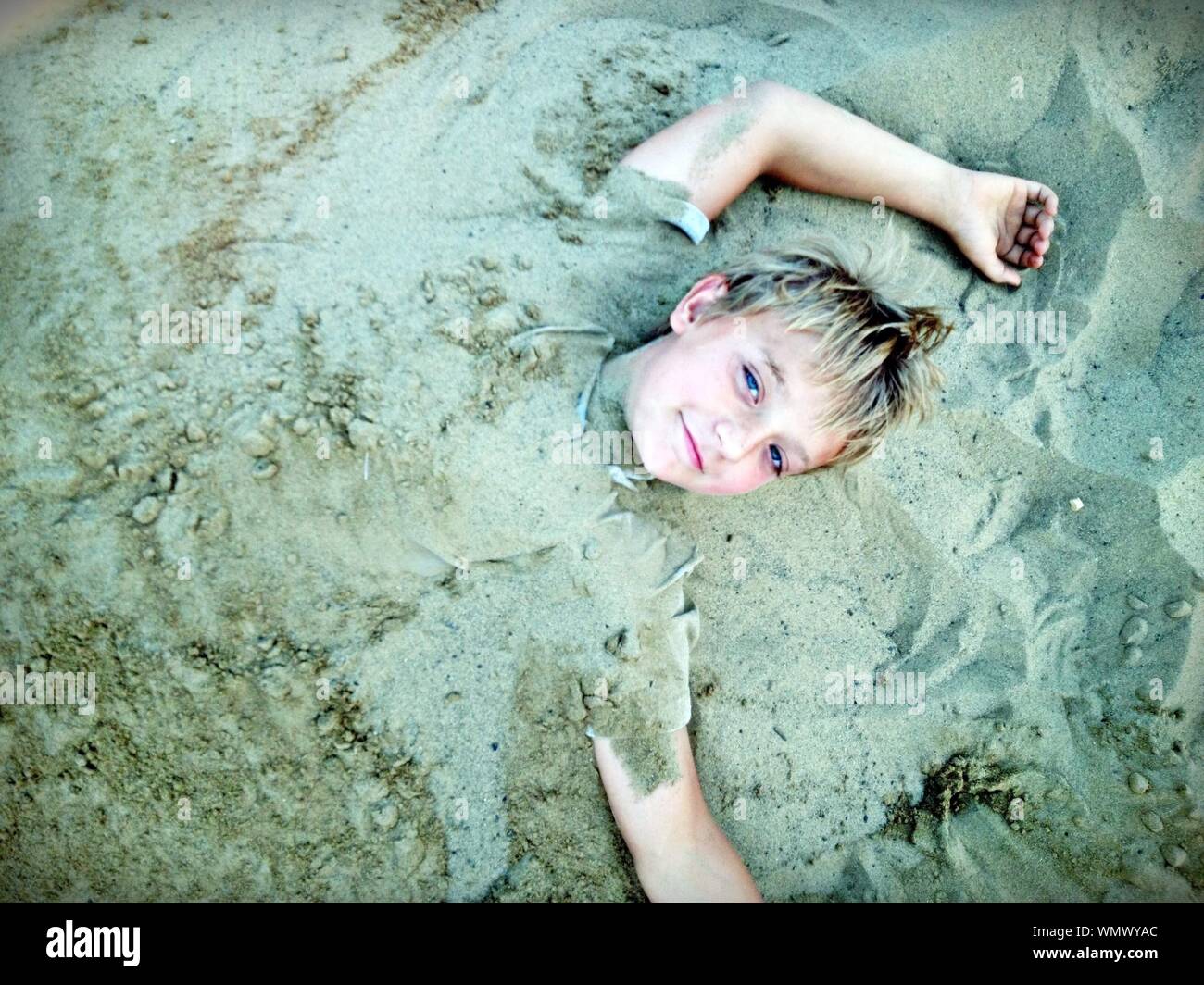 People buried in sand hi-res stock photography and images - Alamy