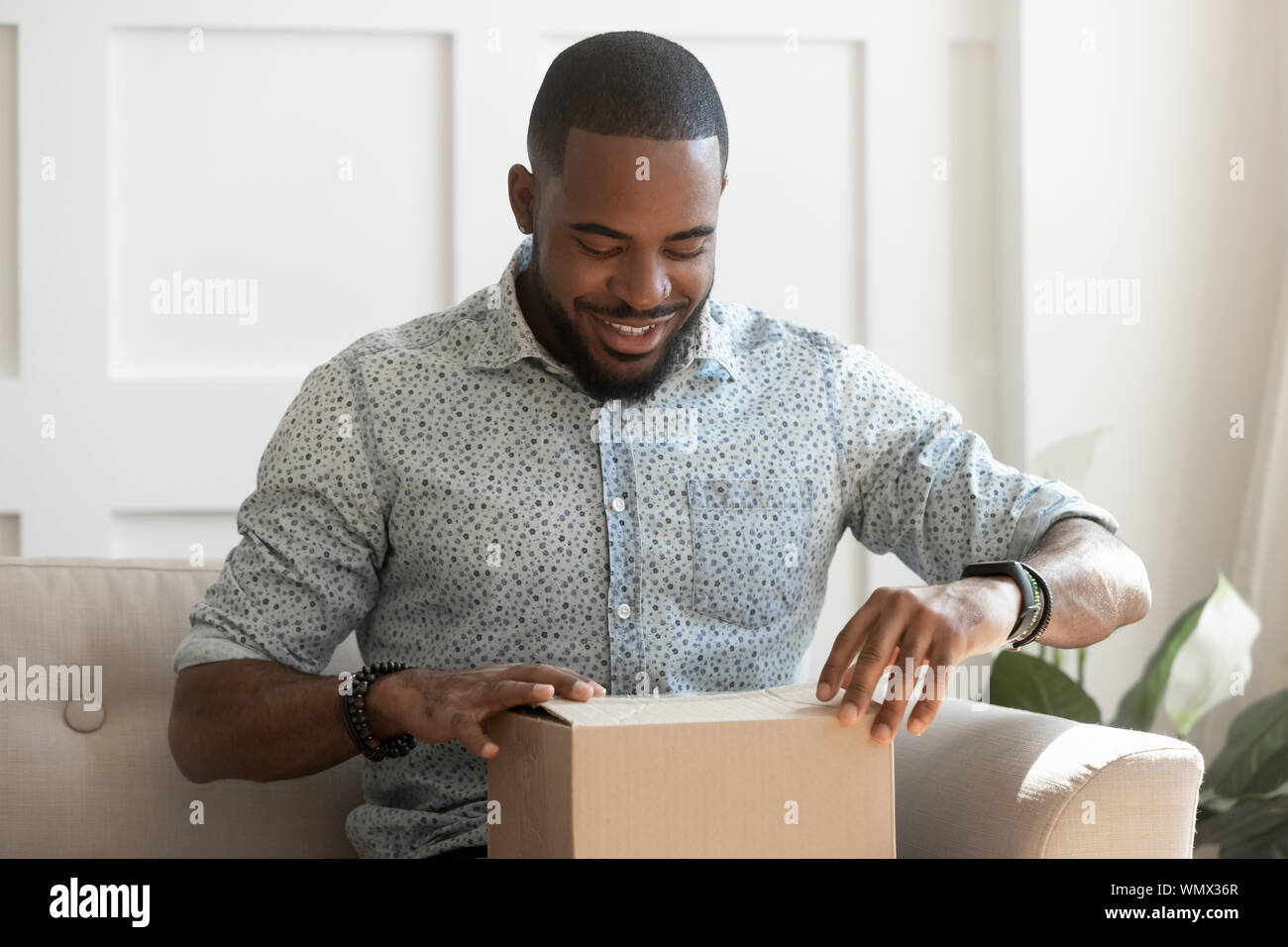 African man unpacking store hi-res stock photography and images - Alamy