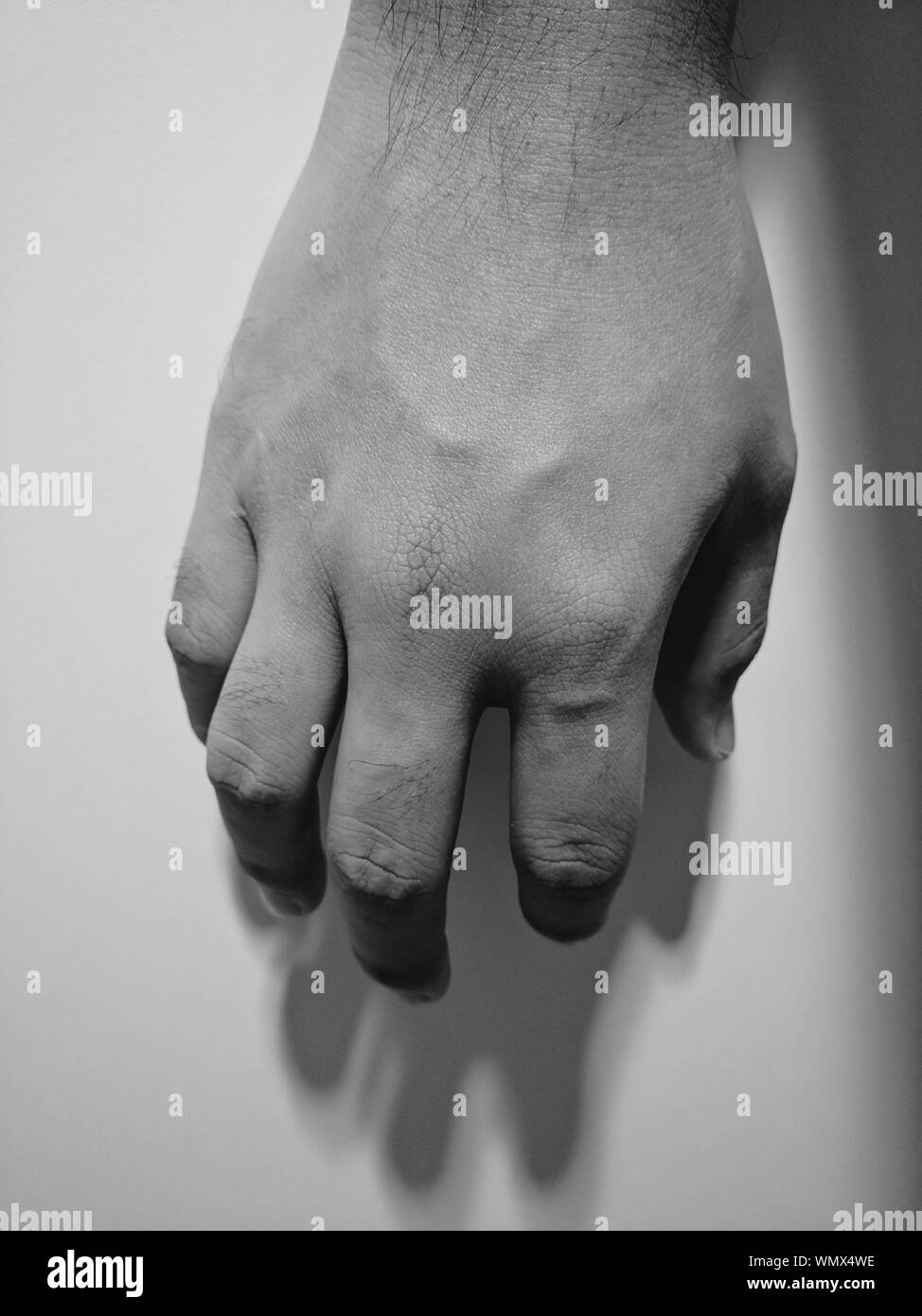 Hand touching wall Black and White Stock Photos & Images - Alamy