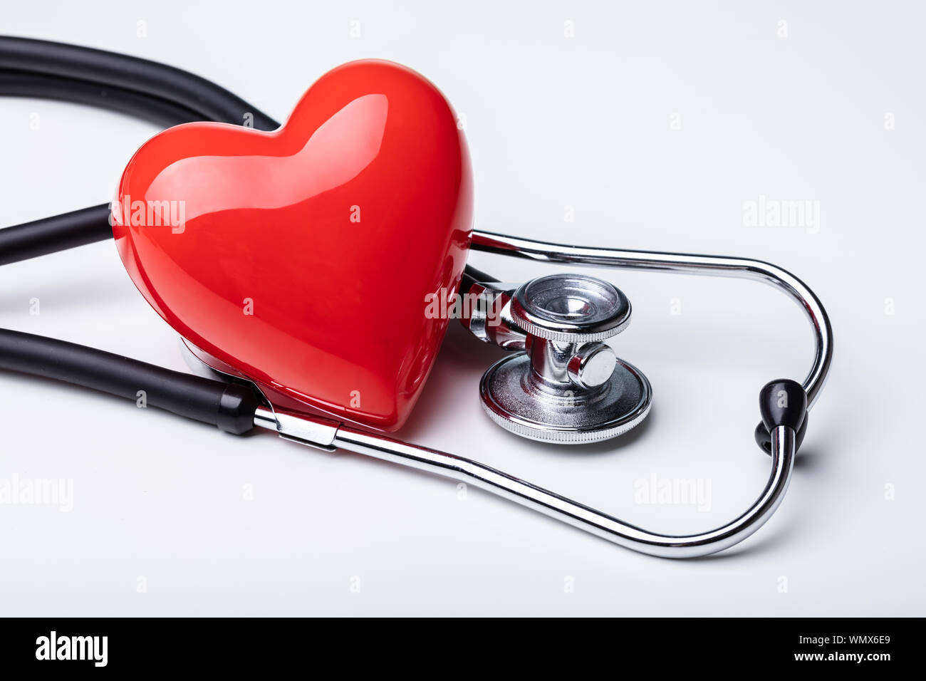 Close-up Of Bright Red Heart And A Stethoscope On White Desk Stock ...