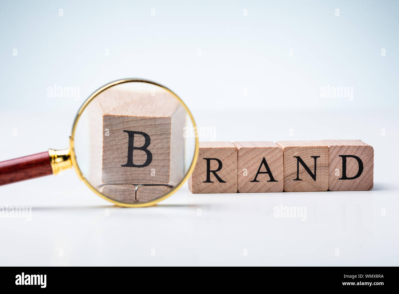 Magnifying Glass Focus On B Letter Block Of Brand Text Against White ...