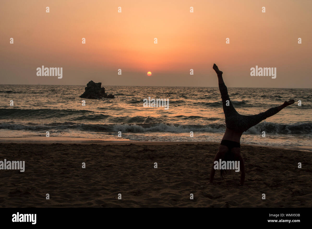 Woman handstand beach sand hi-res stock photography and images - Alamy