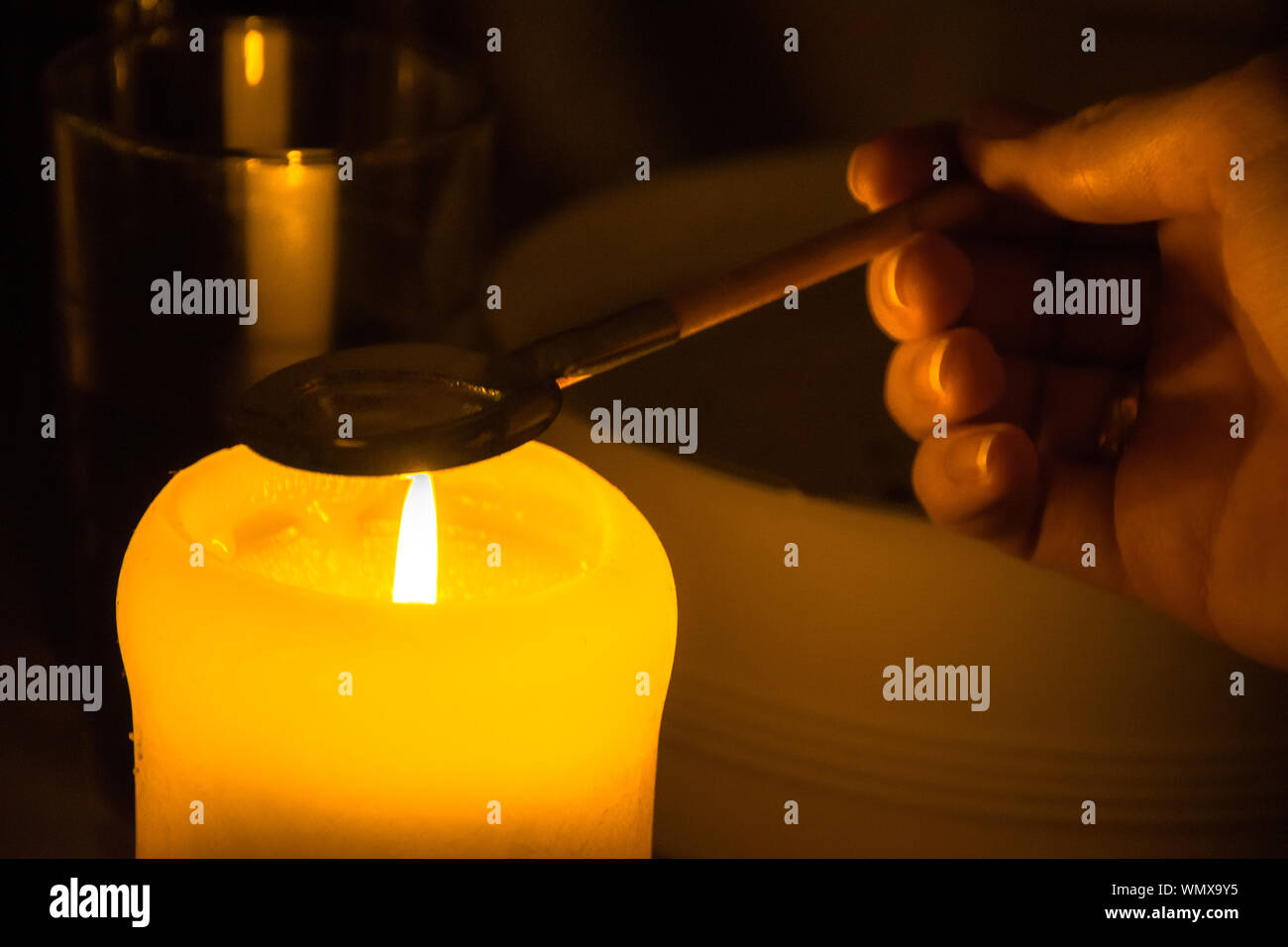 Hand holding candle home hi-res stock photography and images - Alamy