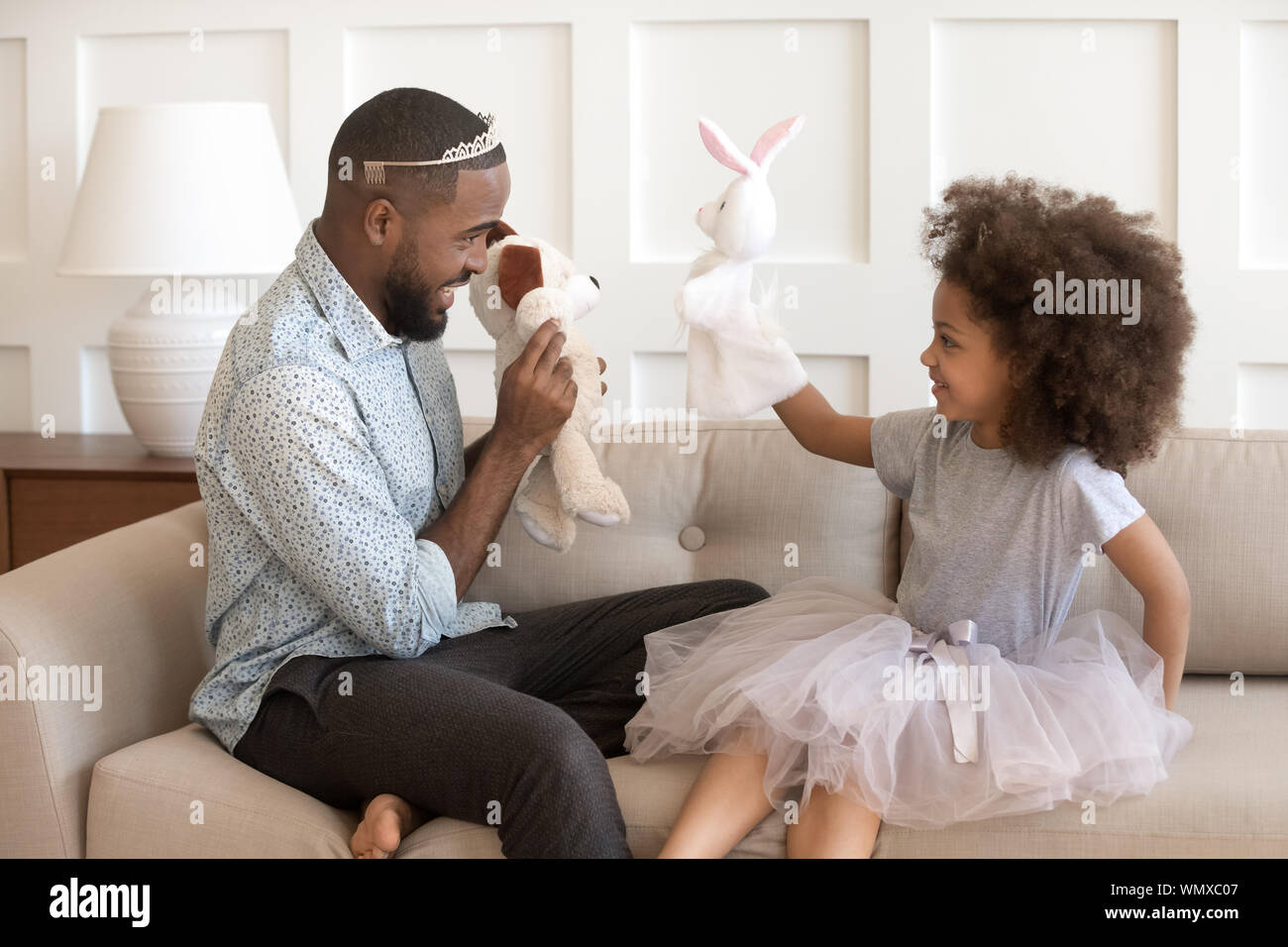 Happy african american father dressed like princesses with little ...