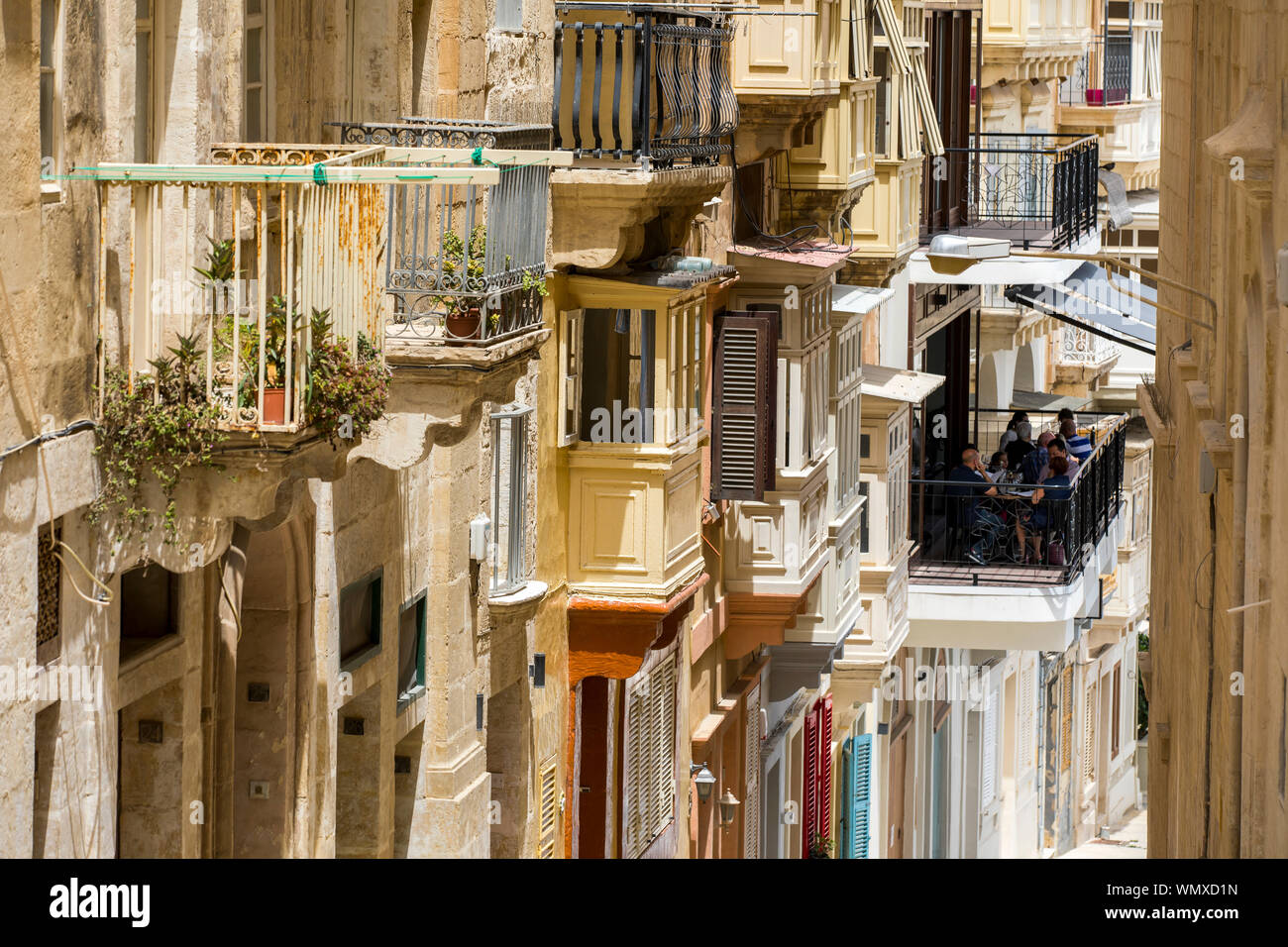 Malta, Valetta, old town, alley with houses and the typical clad ...
