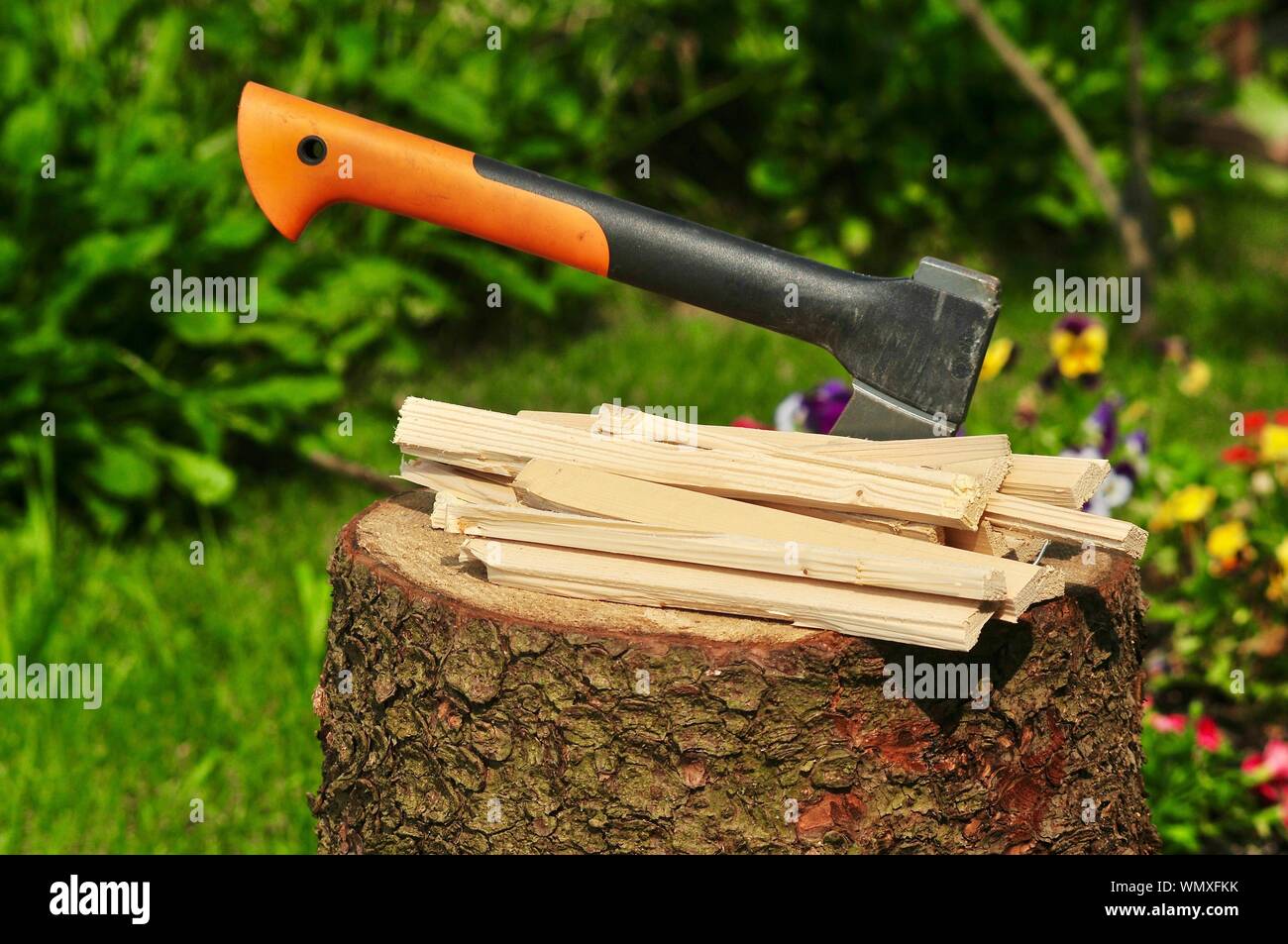 Axe stuck in tree hi-res stock photography and images - Alamy
