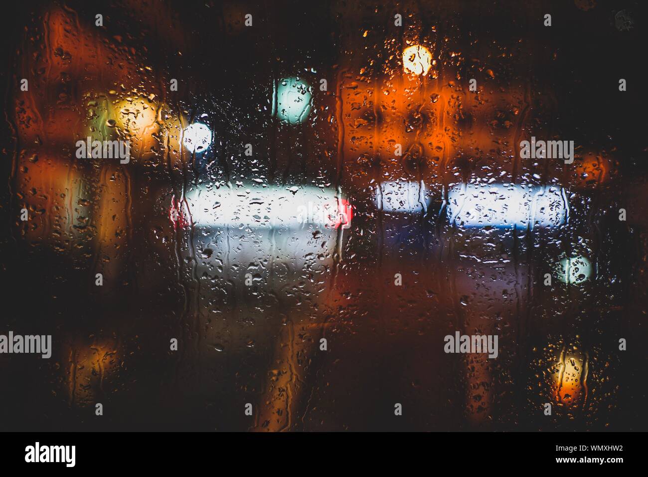 City through rainy window at night hi-res stock photography and images ...