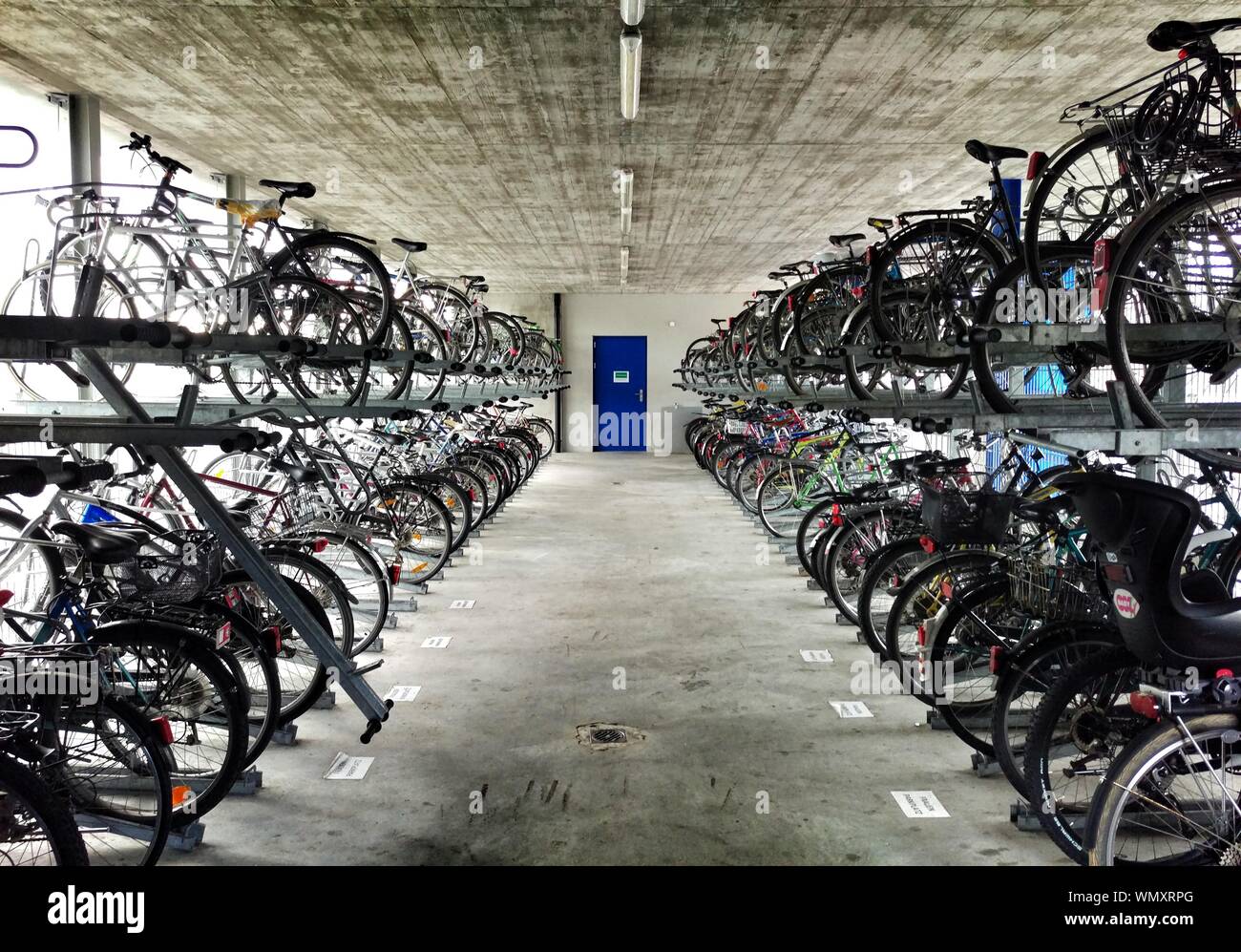 Row Of Bicycles In Parking Lot Stock Photo - Alamy
