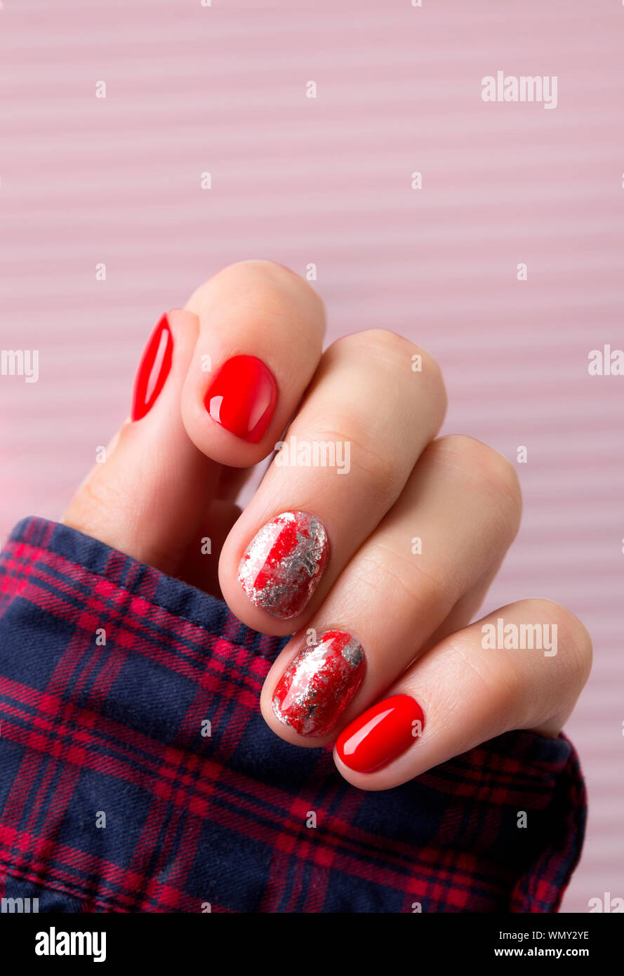 Beautiful manicured woman's hand at red striped white background Stock ...