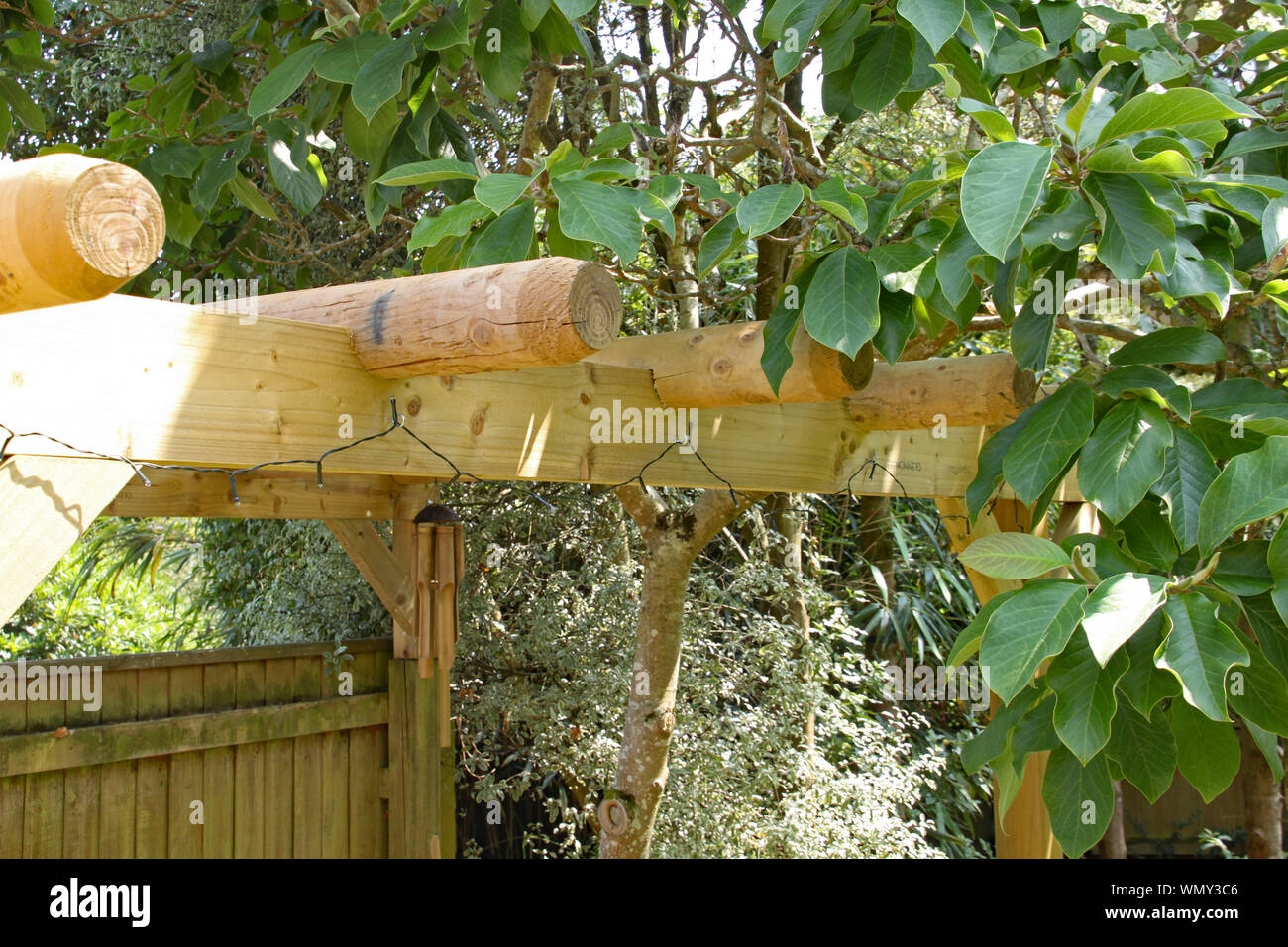 A quiet relaxing and shady area in a back garden under a pergola and ...