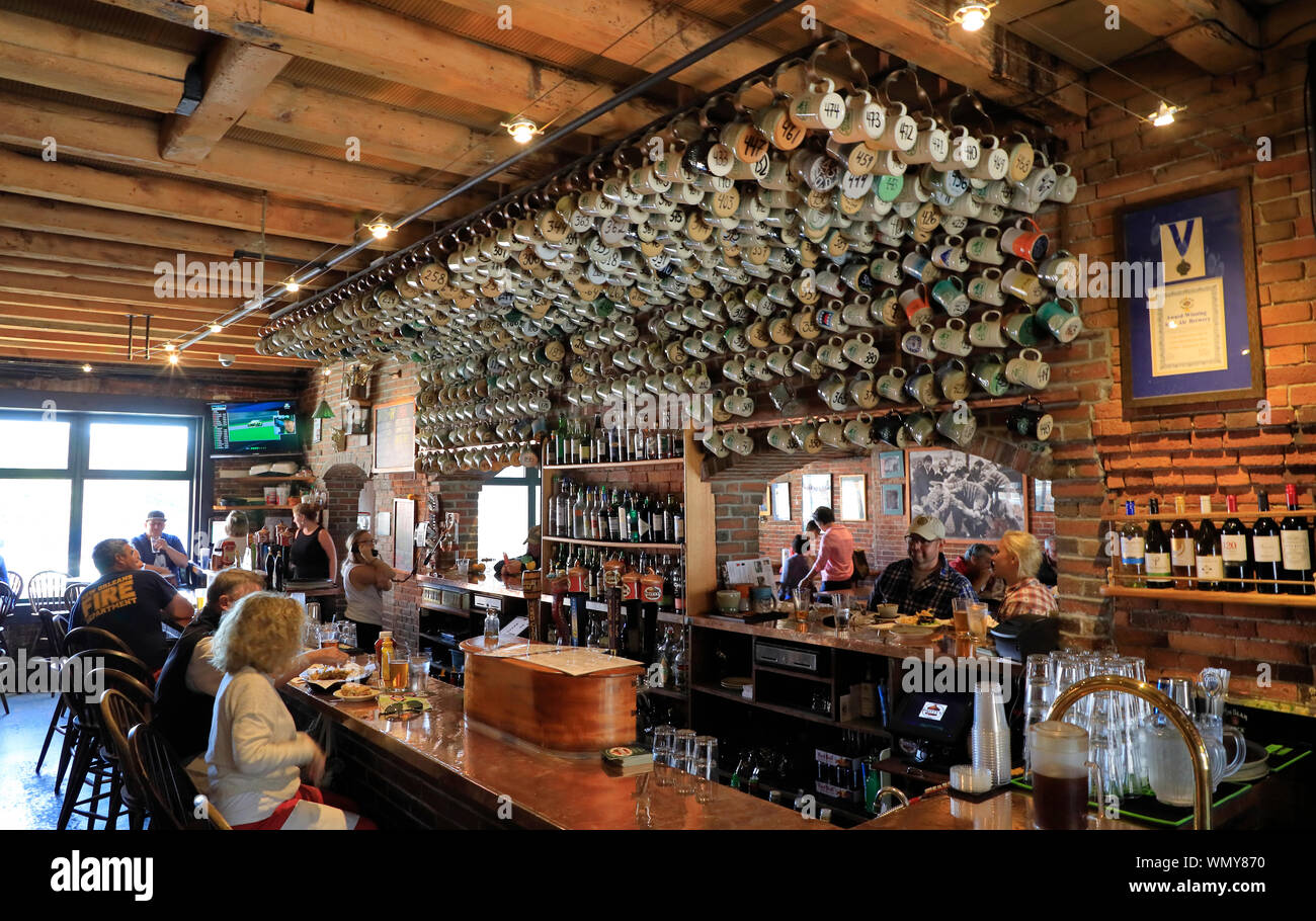 Beer mugs hanging over the bar of Gritty's Portland Brew Pub.Old Port ...