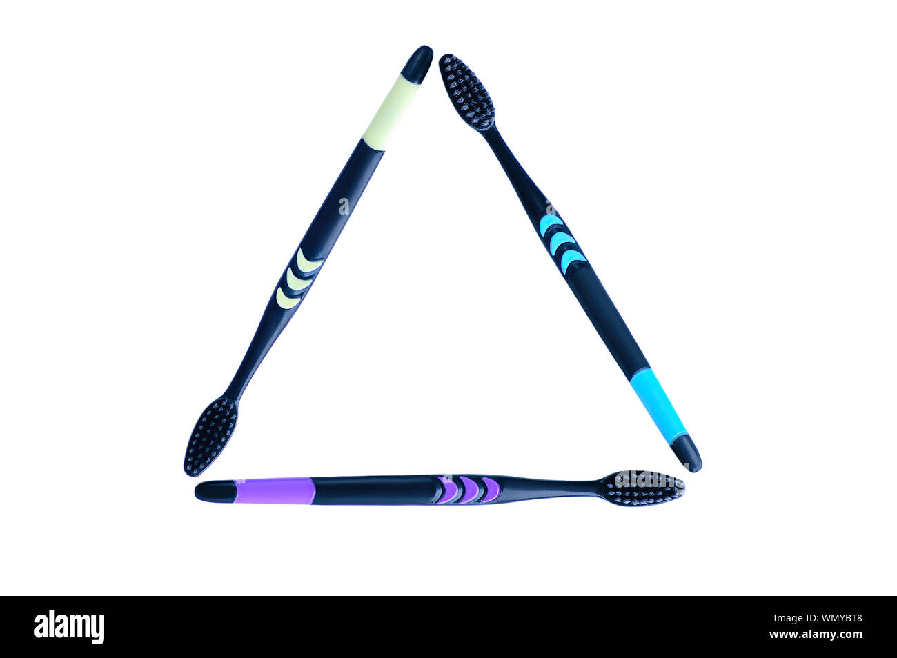 Three black toothbrushes with large carbon bristles. Lie in the shape ...