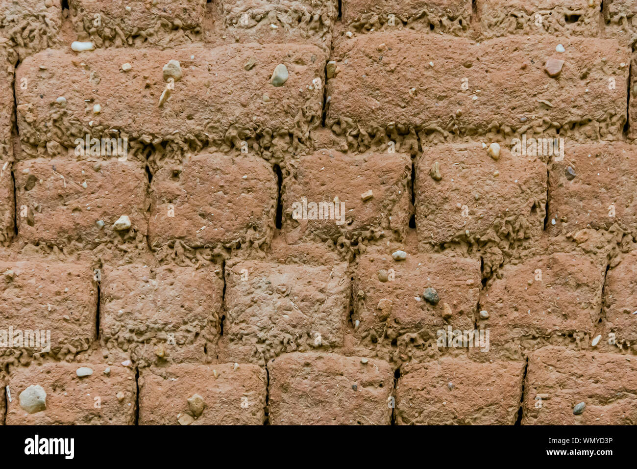 Adobe bricks wall background Stock Photo - Alamy