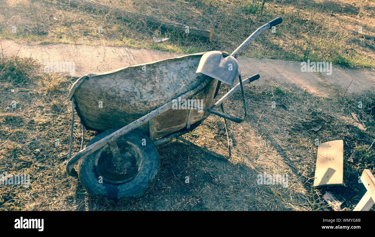 Broken wheelbarrow hi-res stock photography and images - Alamy