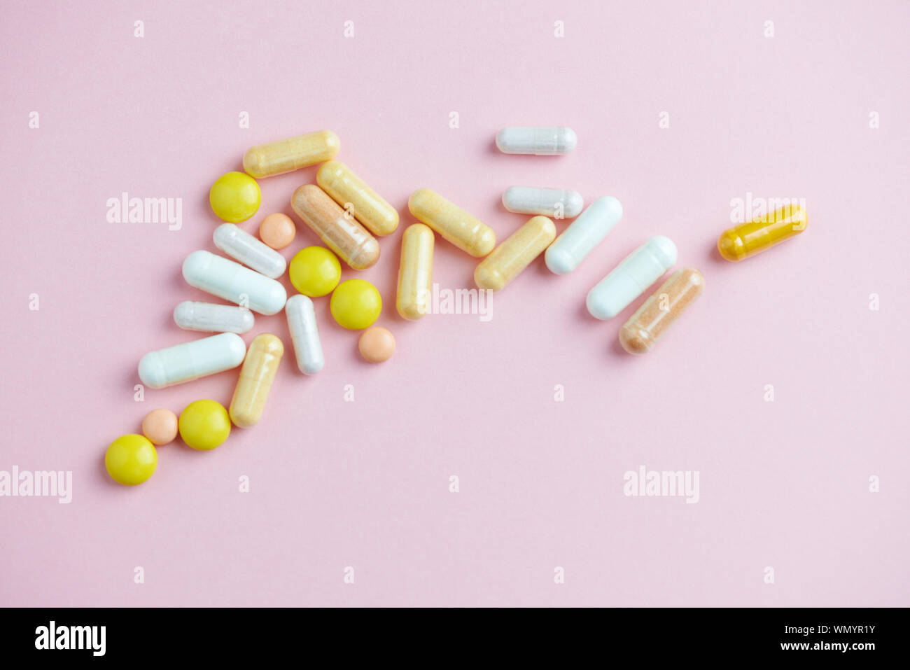 Vitamins and supplements on bright paper background. Concept for a ...