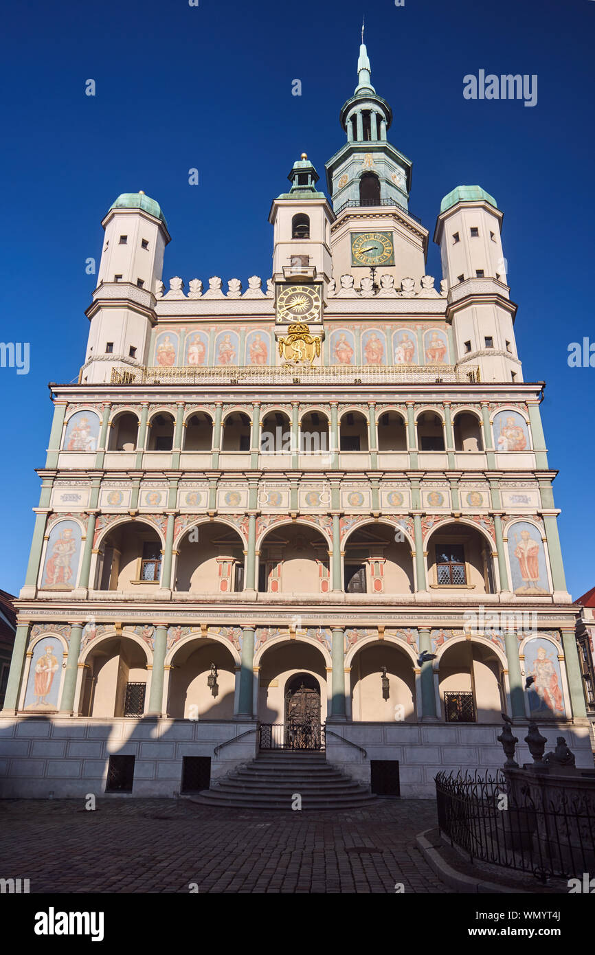 The facade of the Renaissance town hall tower with clock in Poznan ...