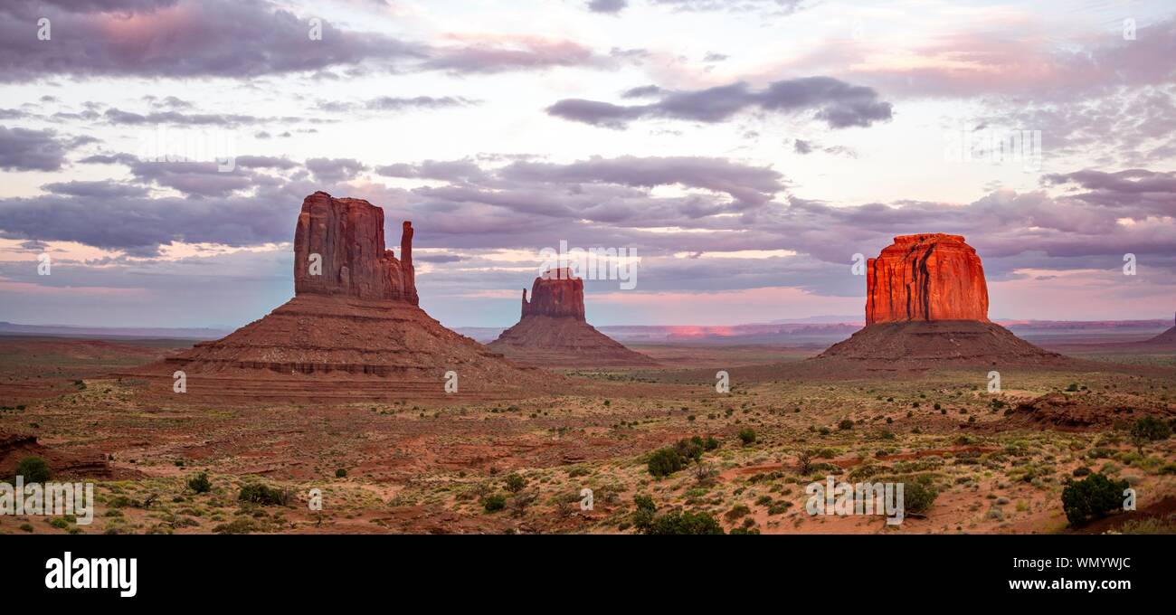 Red glowing rock formation at sunset, Table mountains West Mitten Butte ...