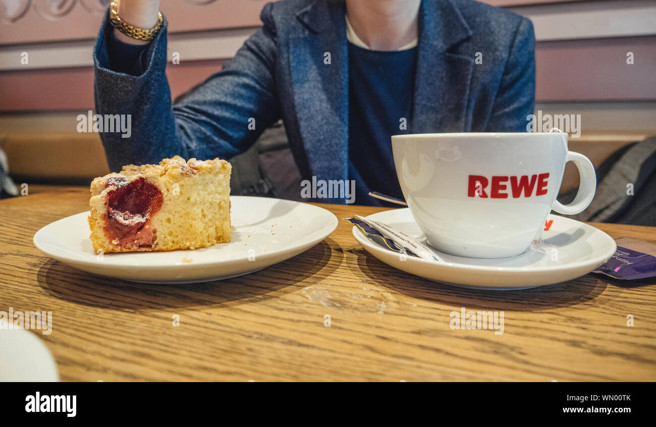 Frankfurt, Germany - May 4, 2019: Woman eating delicious cherry cake ...