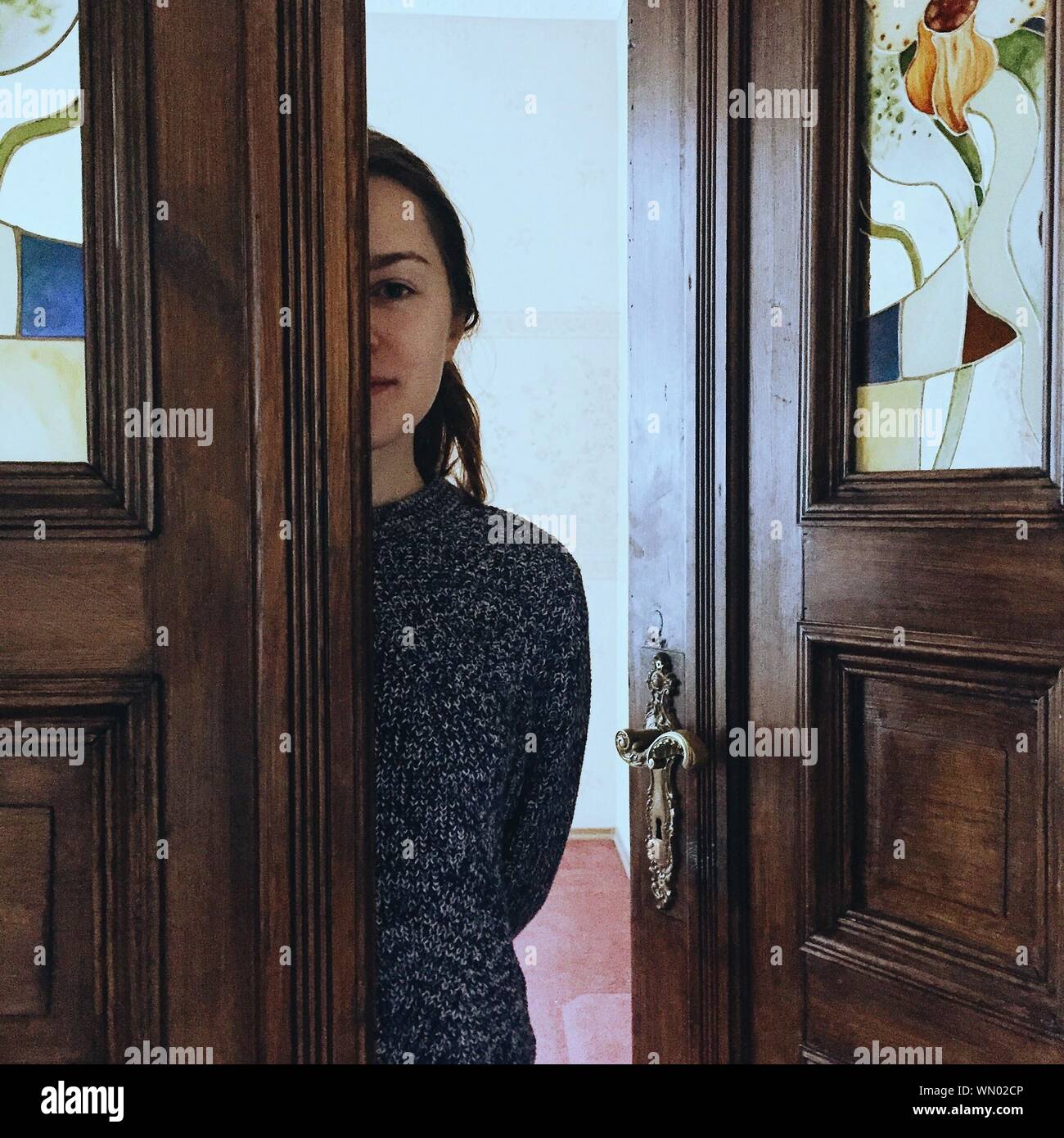 Standing behind door hi-res stock photography and images - Alamy