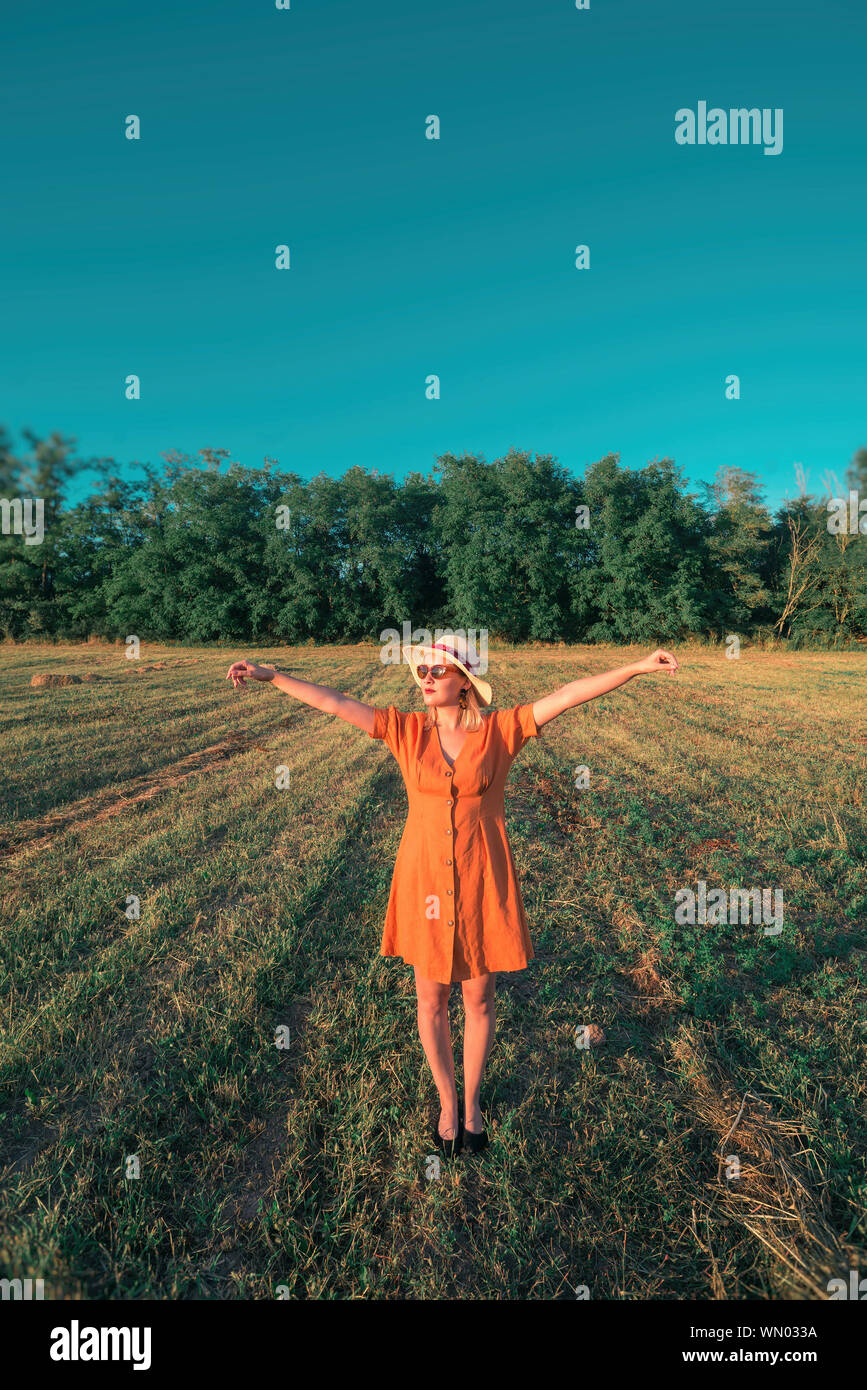 Woman with open arms in nature hi-res stock photography and images - Alamy