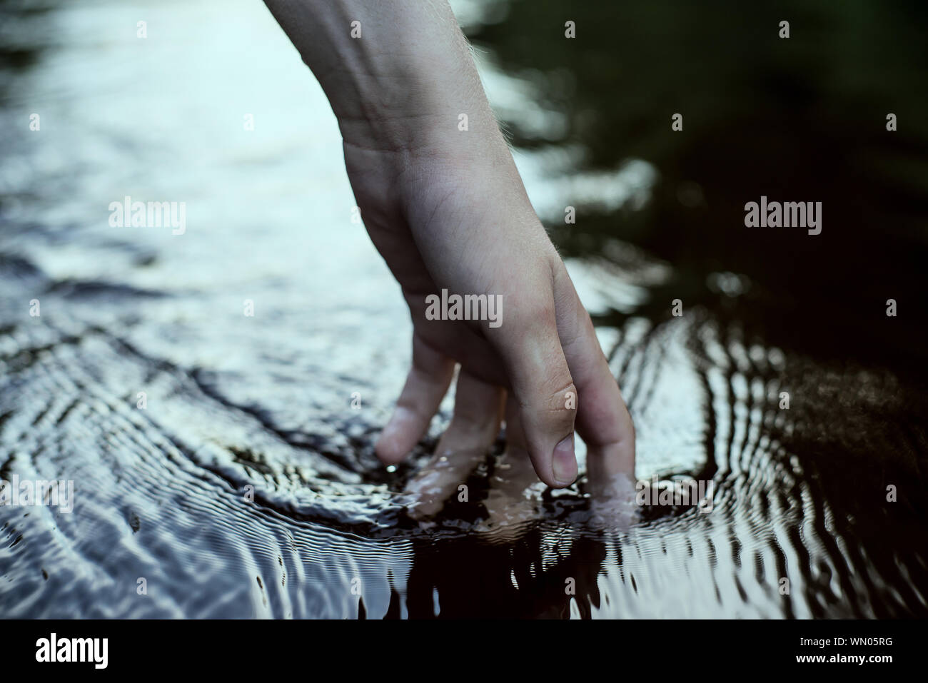 Hand in water hi-res stock photography and images - Alamy
