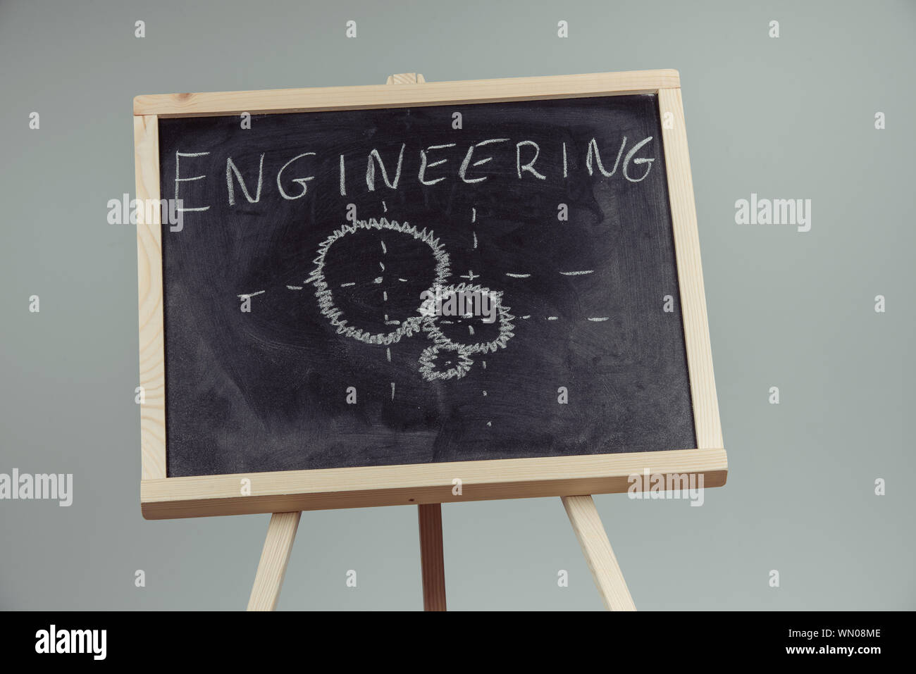 Engineering word handwritten on chalkboard. Gray background Stock Photo ...
