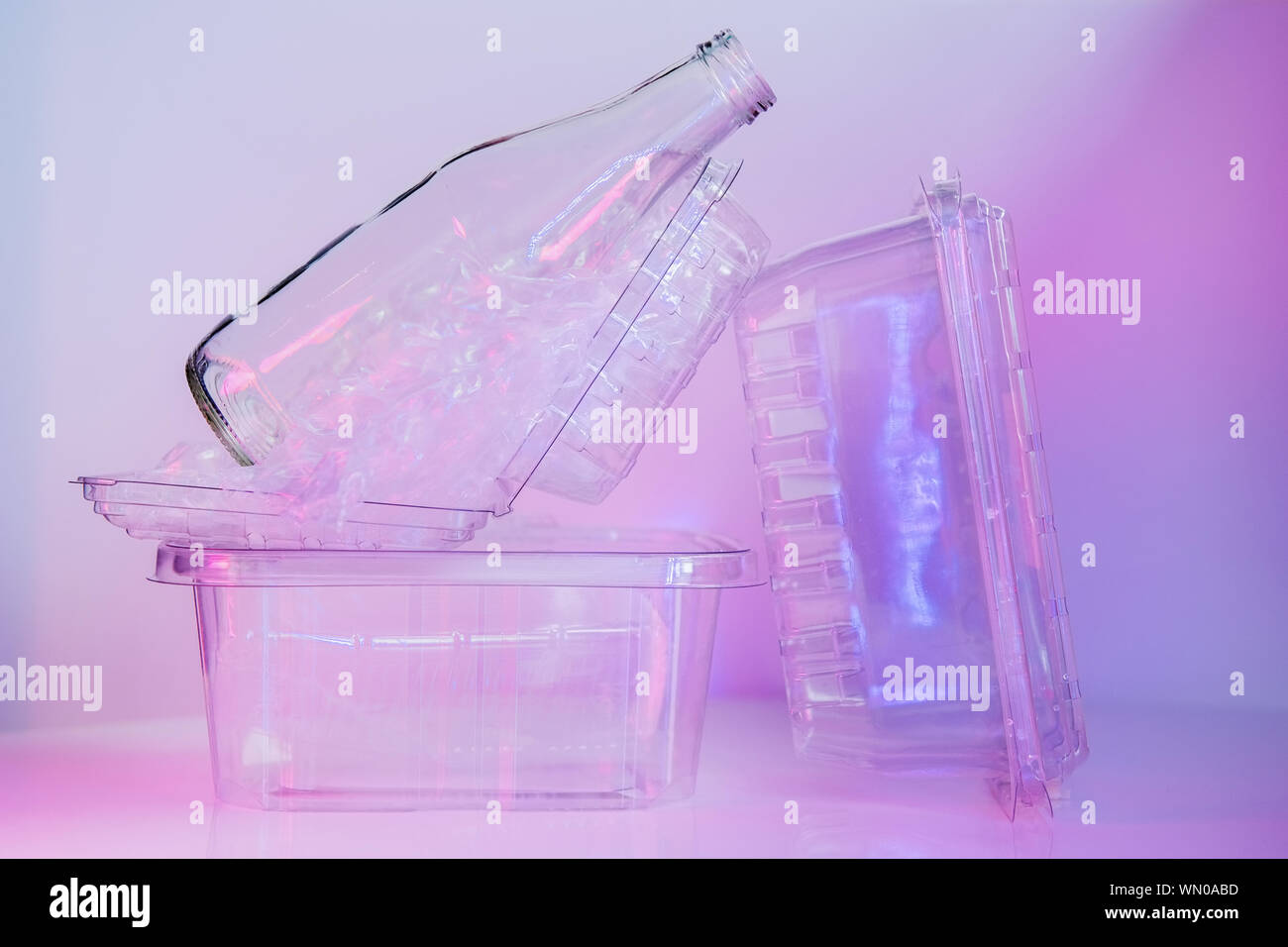 Glass bottle and plastic containers Stock Photo - Alamy