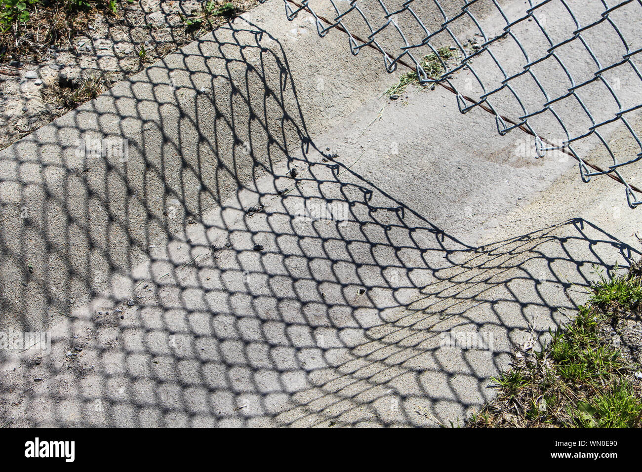 Chain link fence shadow hi-res stock photography and images - Alamy
