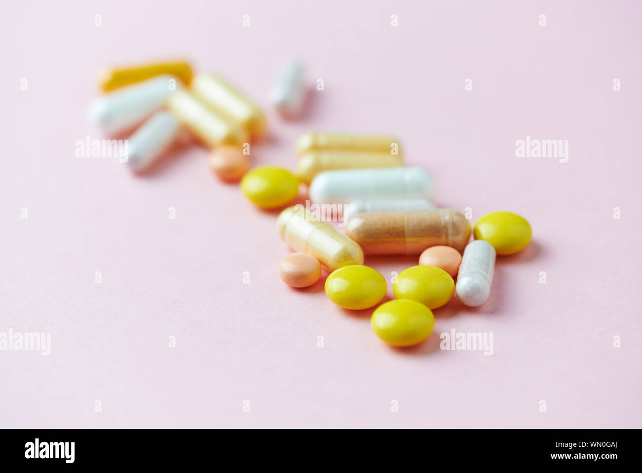 Vitamins and supplements on bright paper background. Concept for a ...