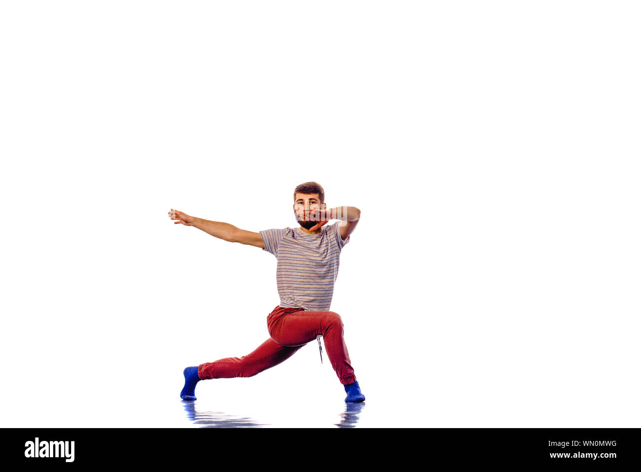 Cool looking dancer posing in front of the studio background Stock ...