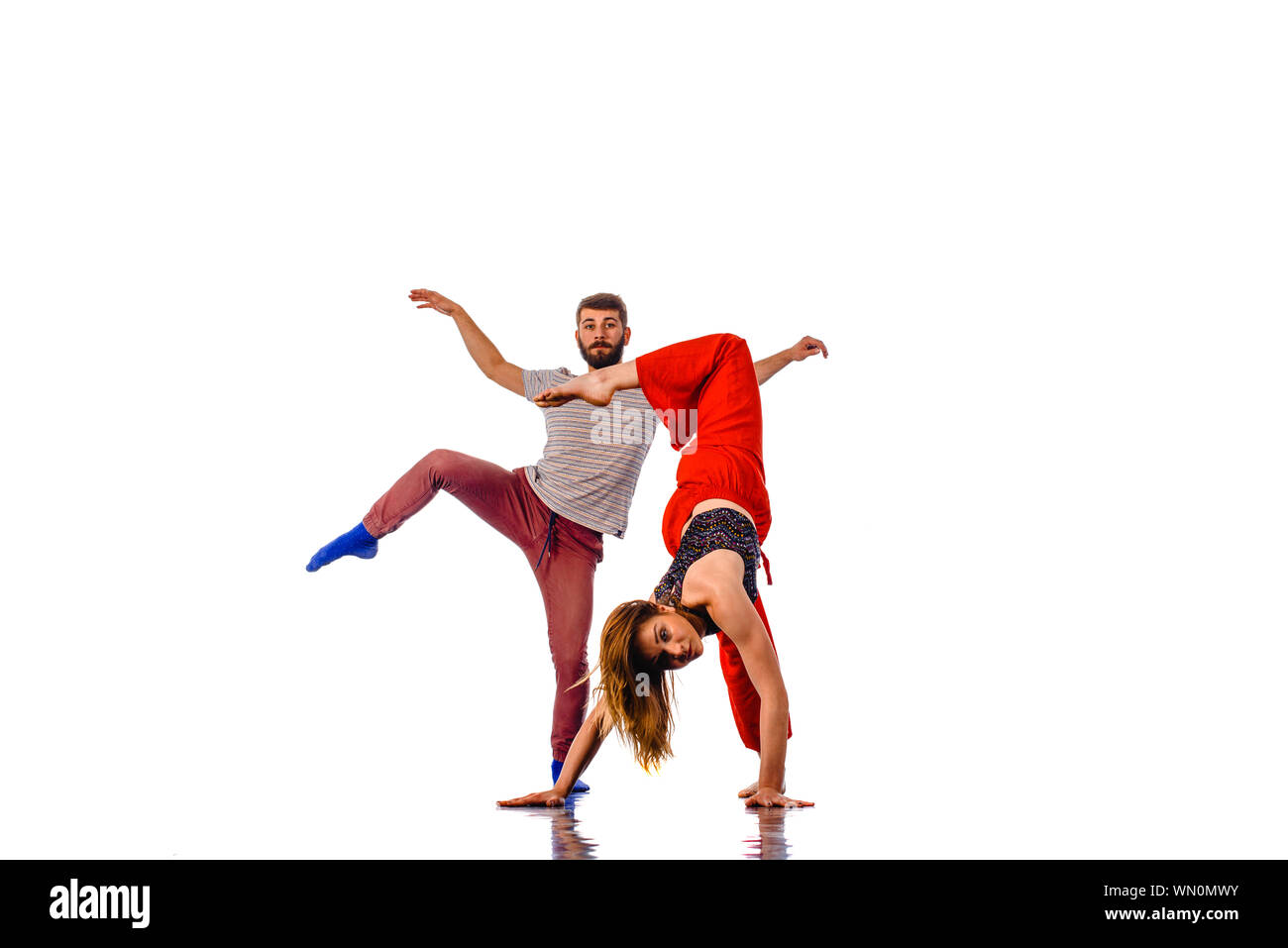 Two athletic young dancers making a performance Stock Photo - Alamy