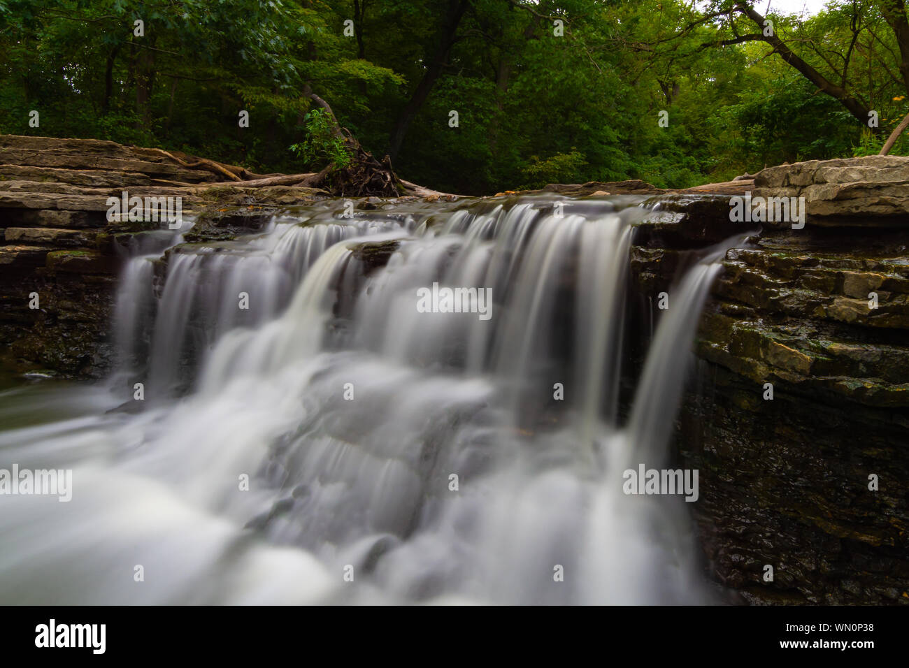 Water flowing down the cascade in Waterfall Glen Forest Preserve ...