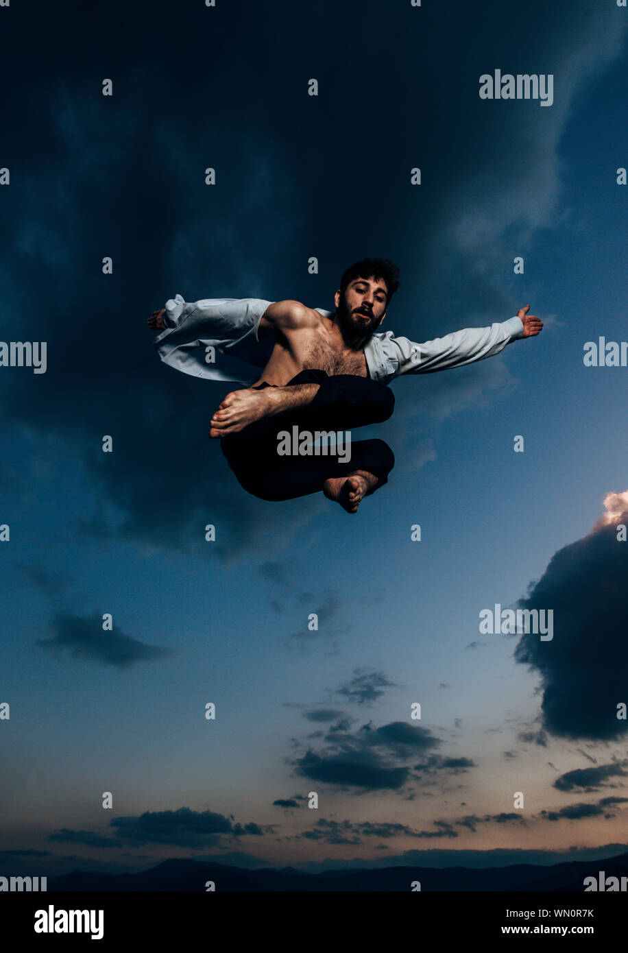 Happiness, freedom, movement and people concept - smiling young man ...