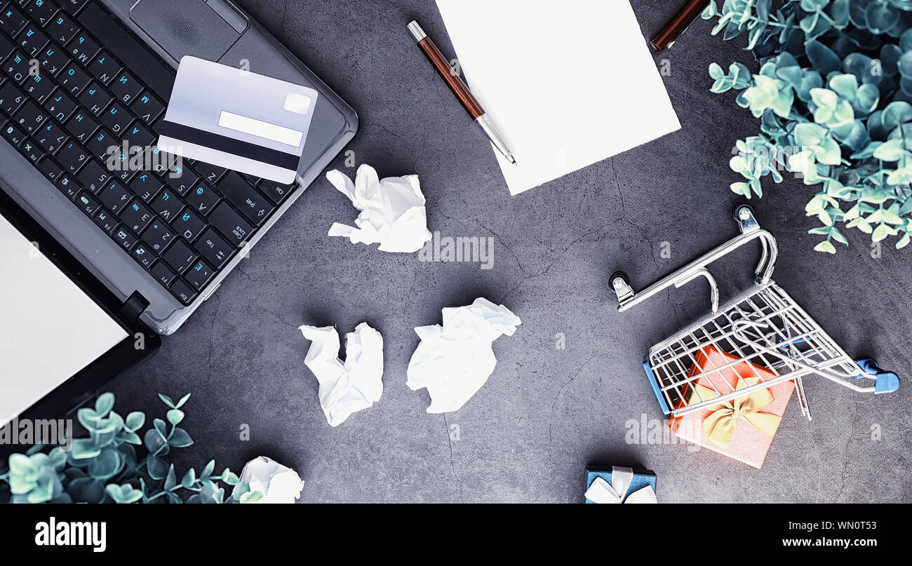 Shopping concept. Supermarket trolley and gifts on the background Stock ...