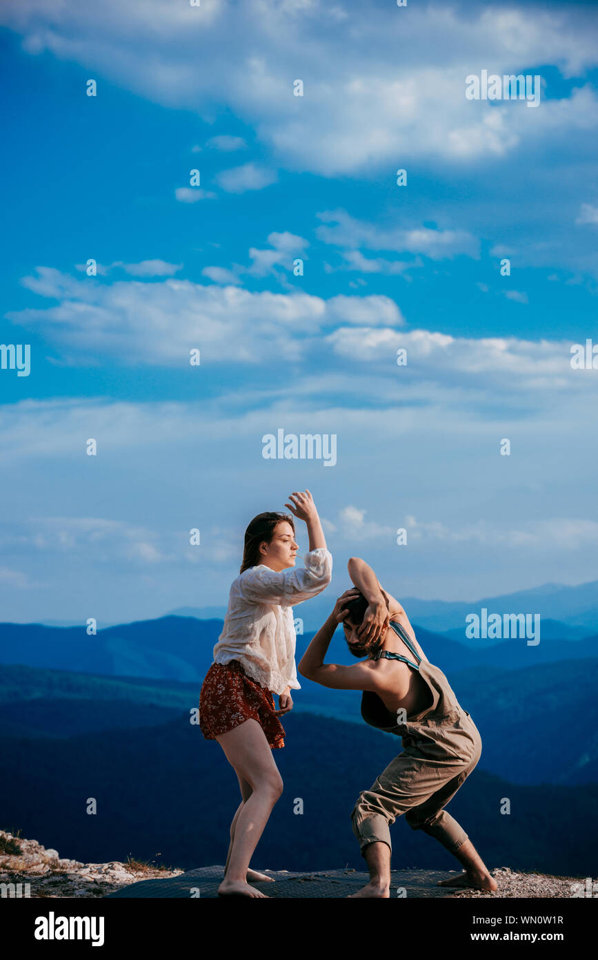 Sensual couple performing an artistical and emotional contemporary ...