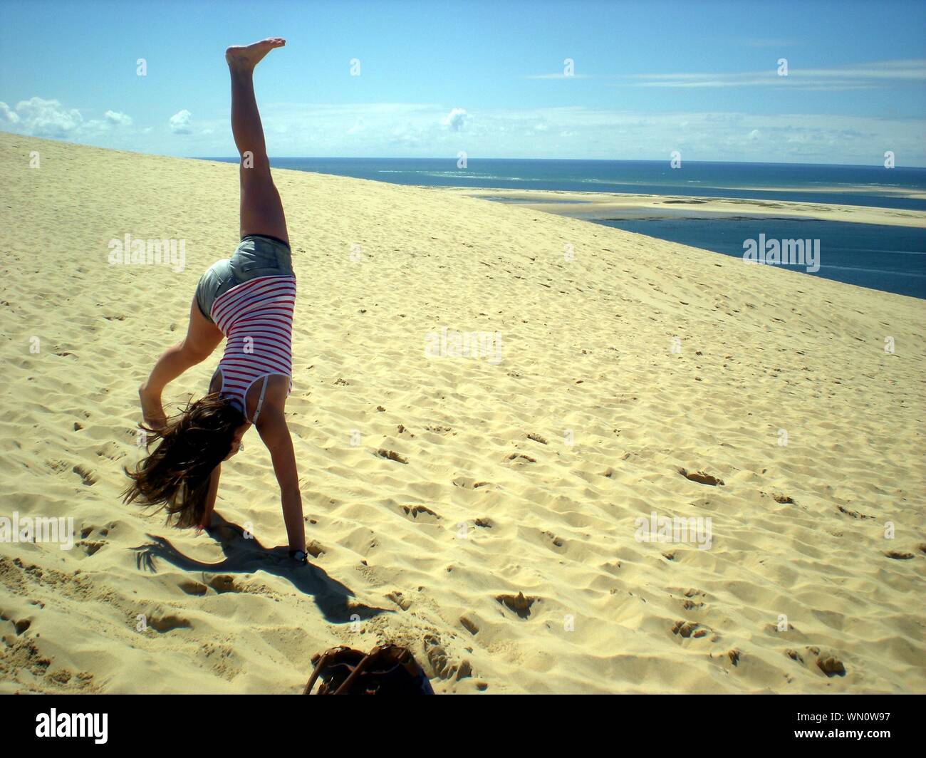 Woman handstand beach sand hi-res stock photography and images - Alamy