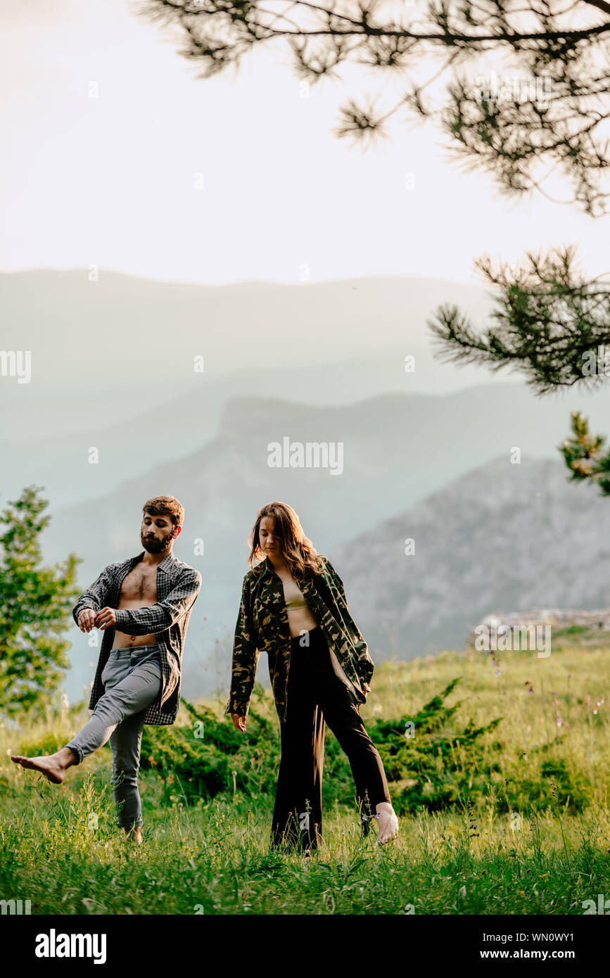 Romantic couple dancing and smiling outside on the meadow Stock Photo ...