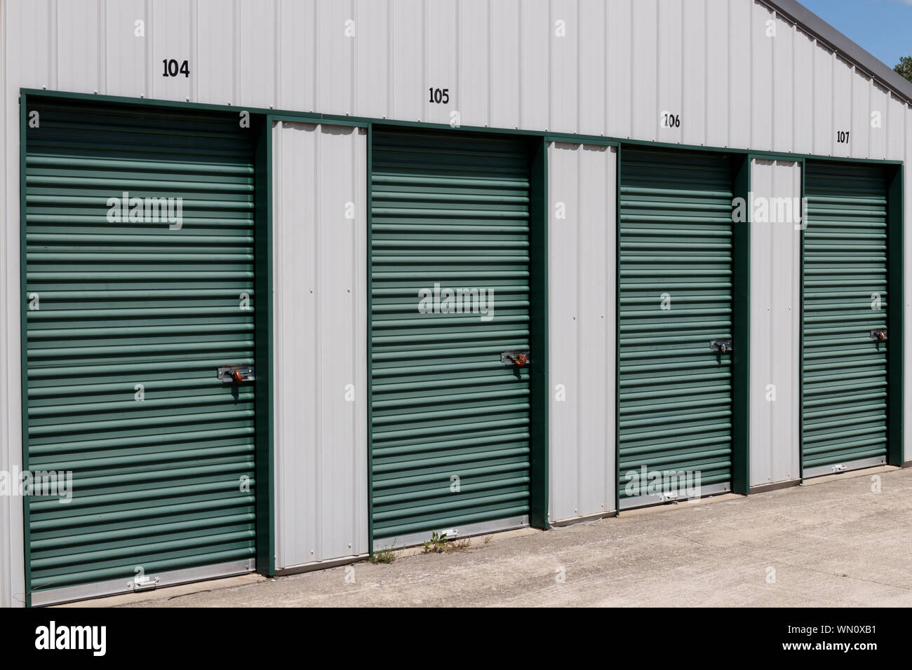 Numbered self storage and mini storage garage units Stock Photo - Alamy