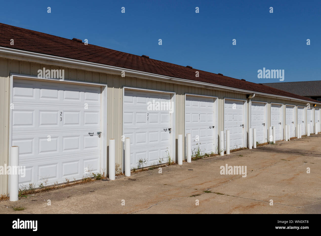 Numbered self storage and mini storage garage units Stock Photo - Alamy